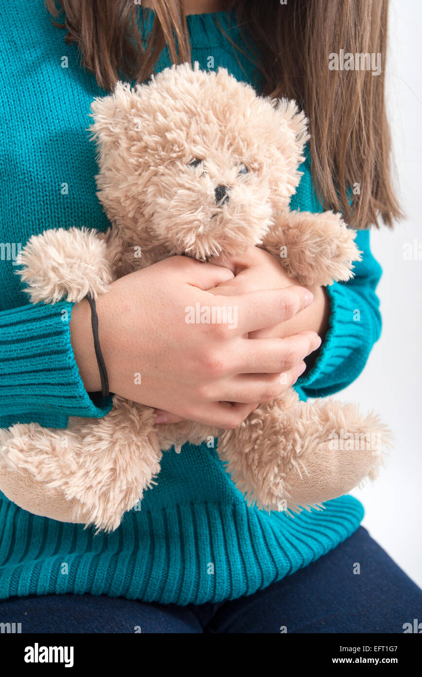 Girl holding teddybear, closeup Stock Photo - Alamy