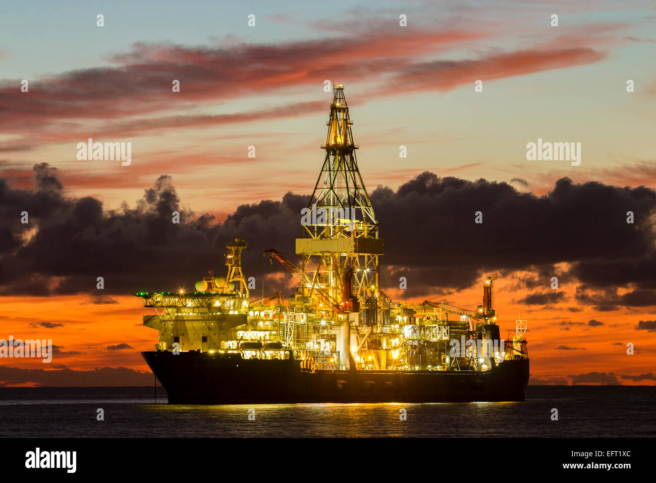 Drill ships/oil rigs at sunrise in Atlantic Ocean Stock Photo - Alamy