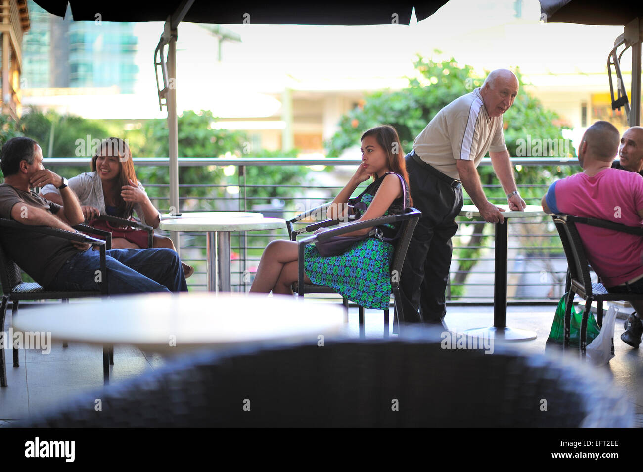 Filipinas socialising with foreigners at Bo's Coffee House the Terraces ...