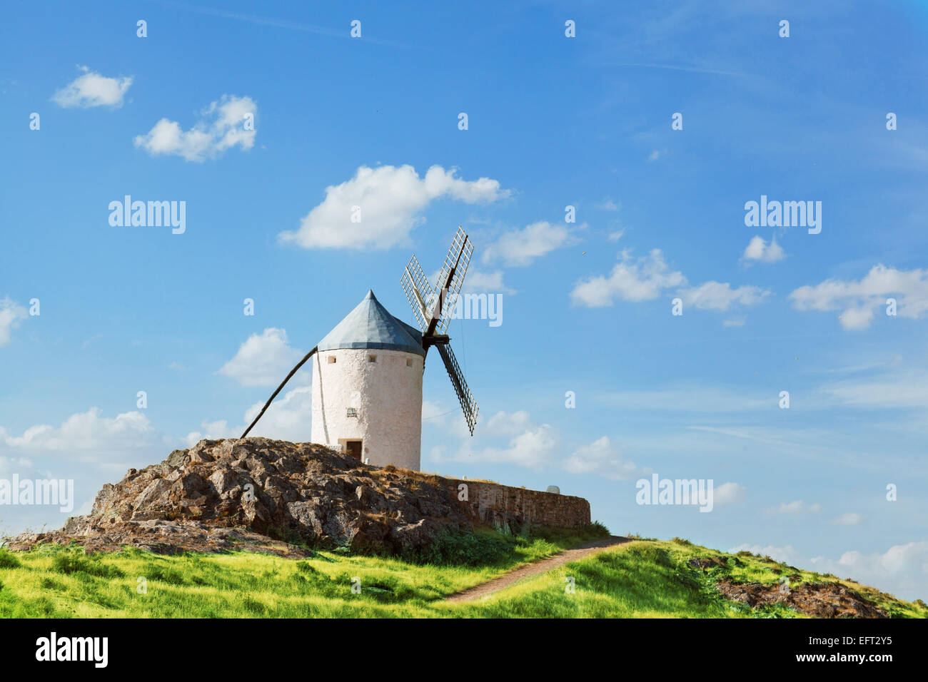 Ancient windmills in the sunny summer day, Konsuegra, Spain Stock Photo ...