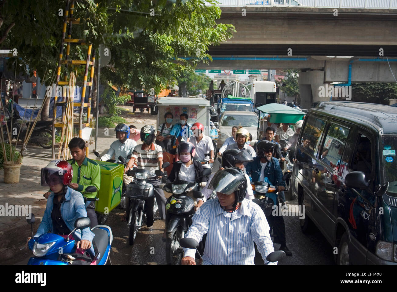 Cars and motorcycles in this very busy cambodian city hi-res stock ...