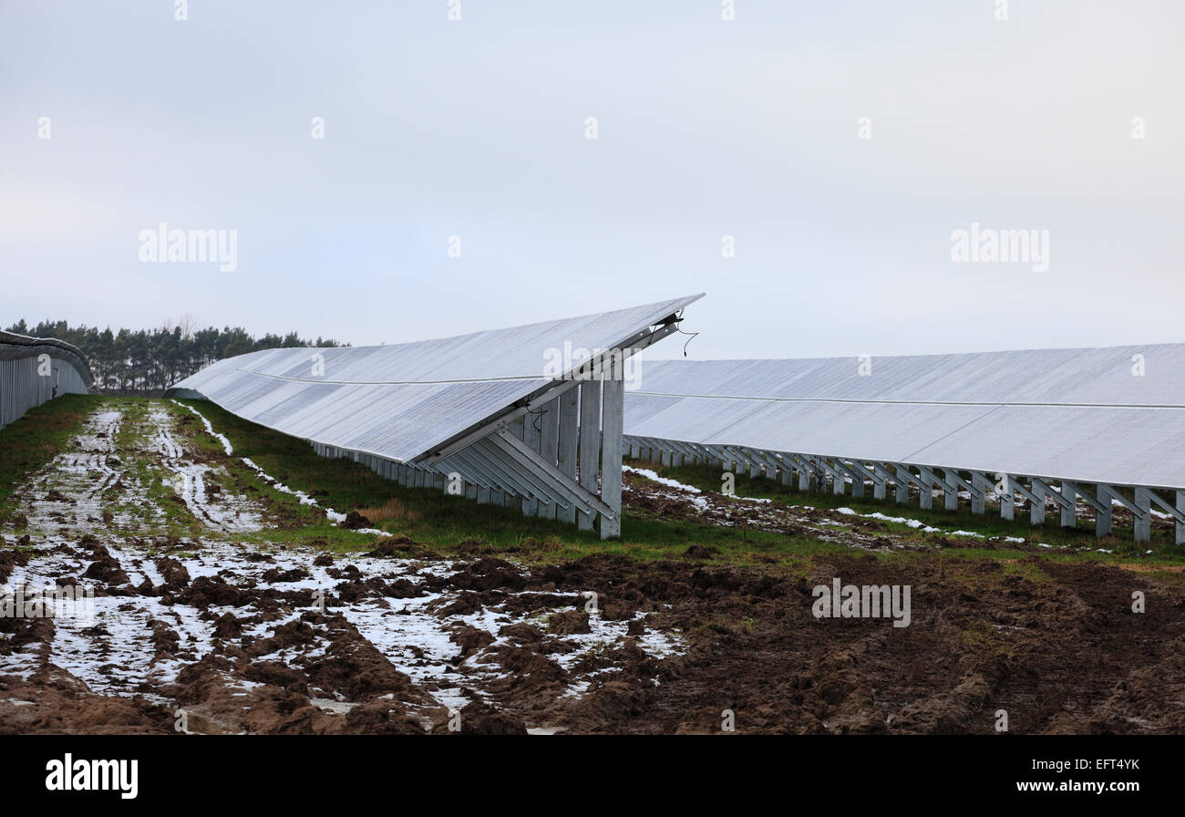 Solar panels at West Raynham solar farm in Norfolk on a wet and cold ...