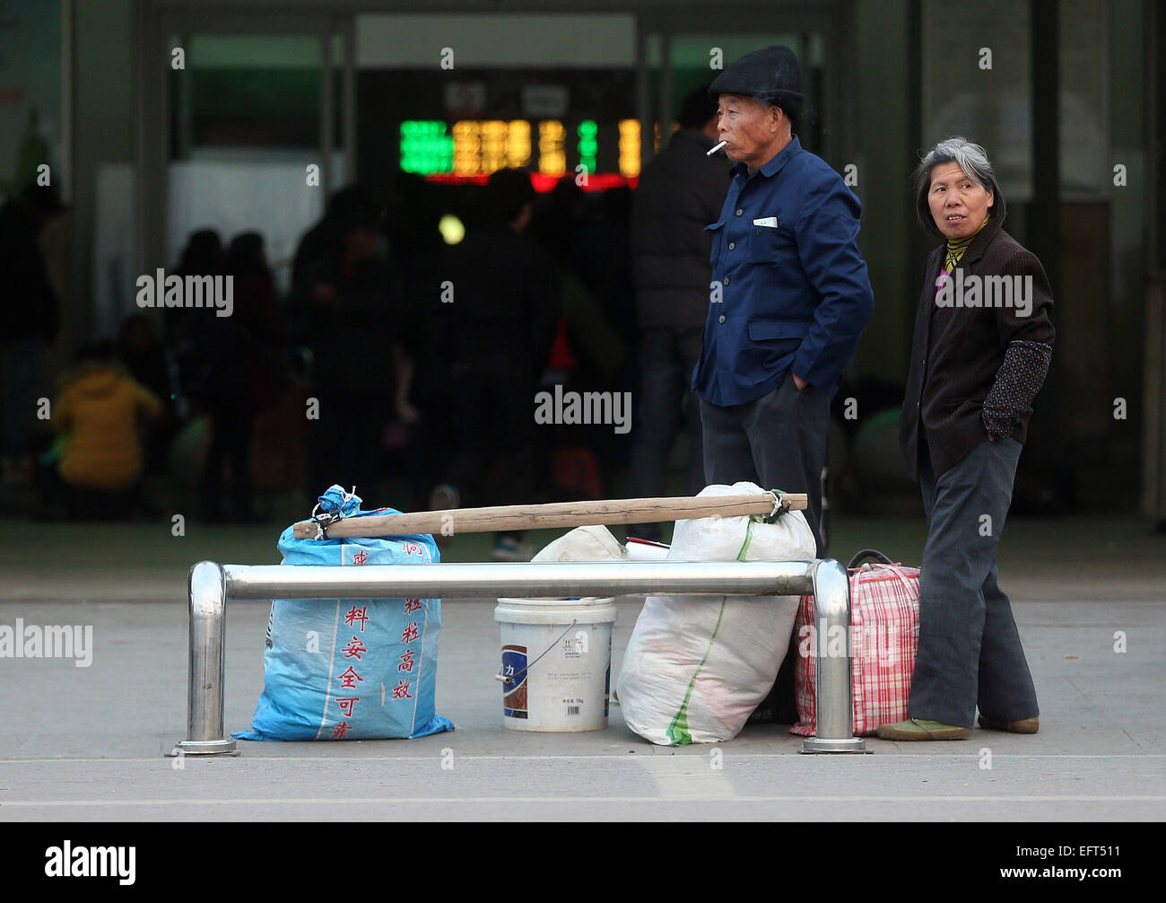 Changsha, China's Hunan Province. 9th Feb, 2015. Two passengers wait ...