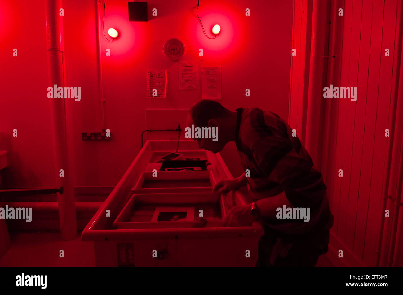 A man develops photographs in a darkroom Stock Photo - Alamy