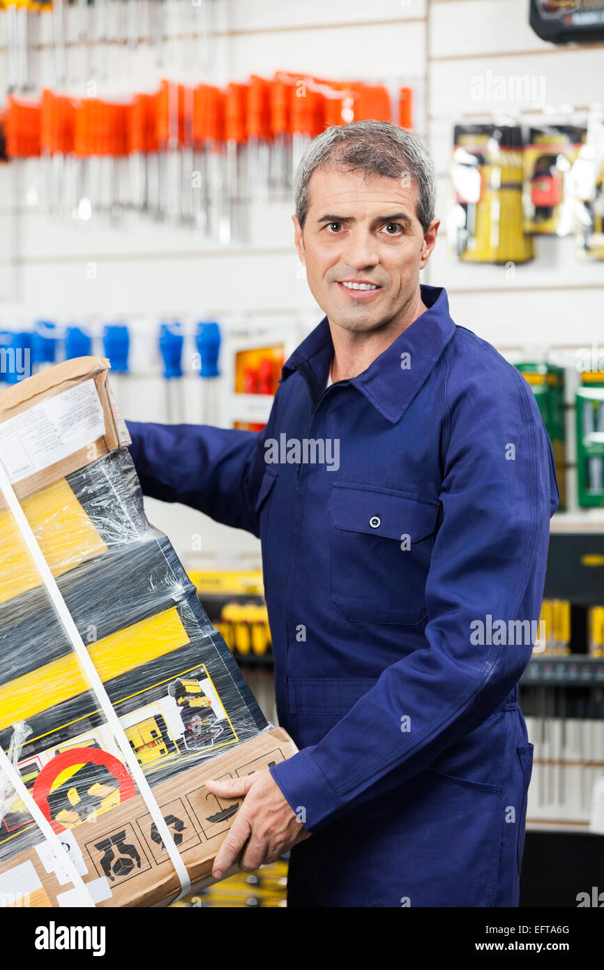 Worker Carrying Tool Package In Hardware Shop Stock Photo - Alamy