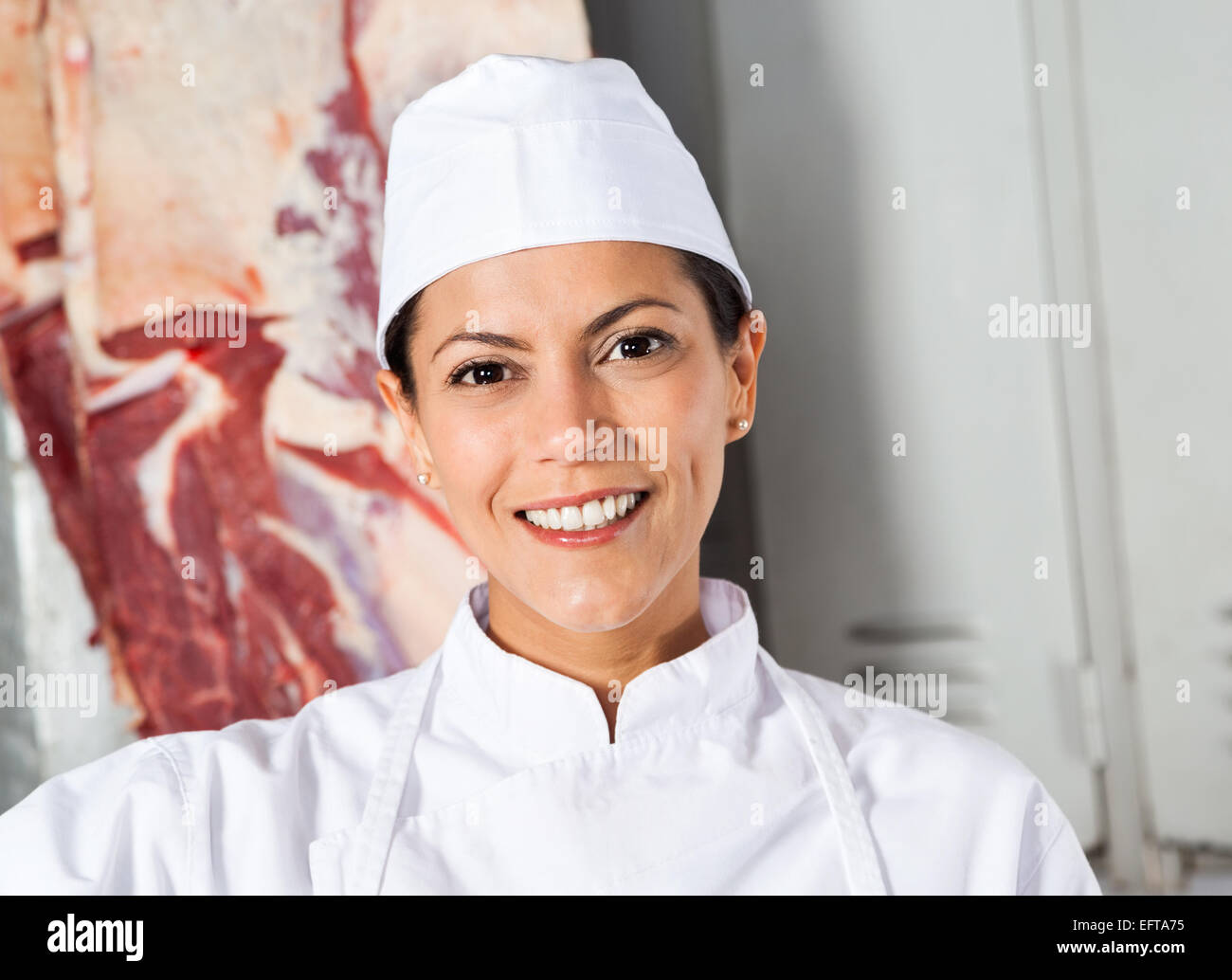 Confident Female Butcher Smiling In Shop Stock Photo - Alamy