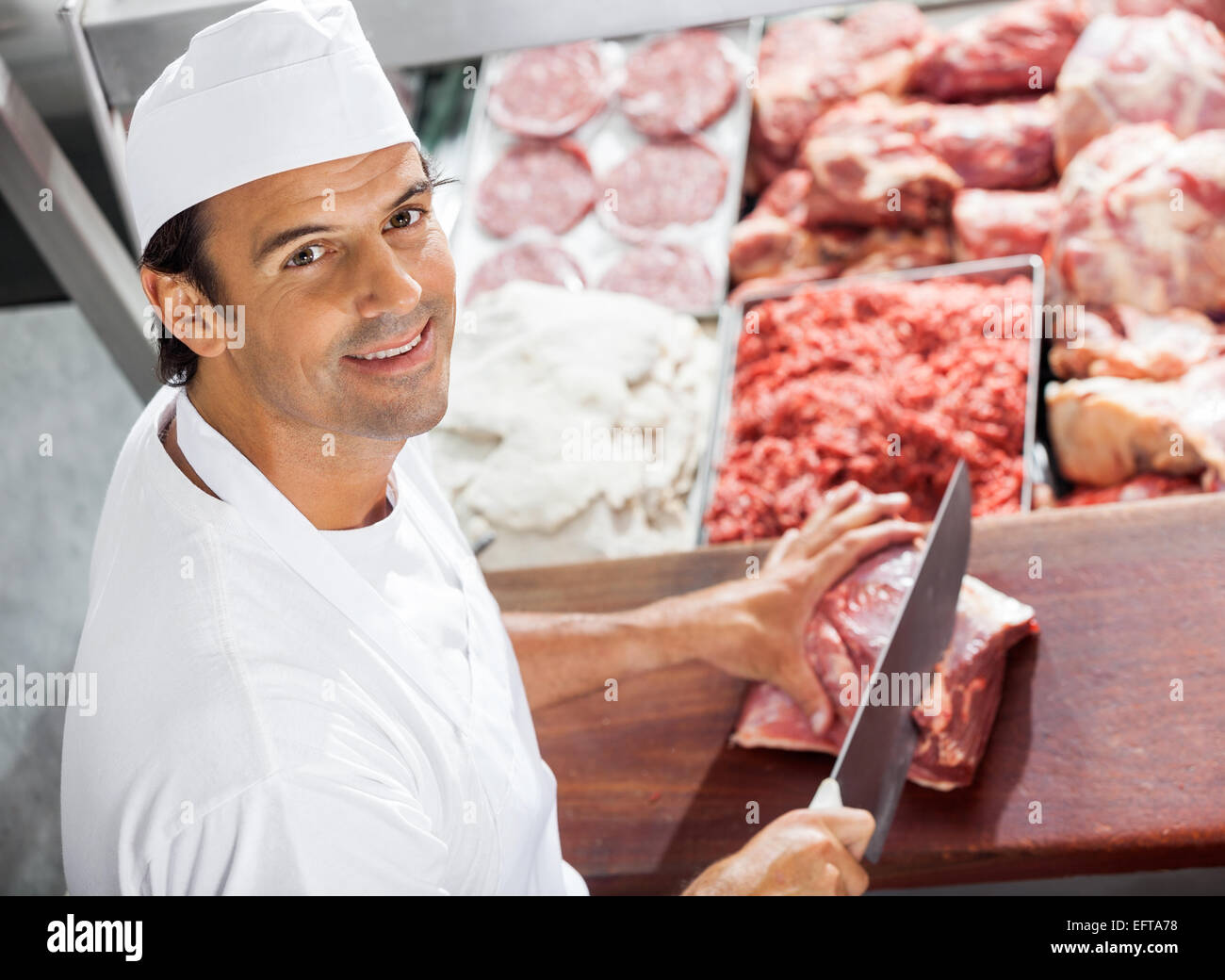 Cut of meat butcher cutting meat hi-res stock photography and images ...