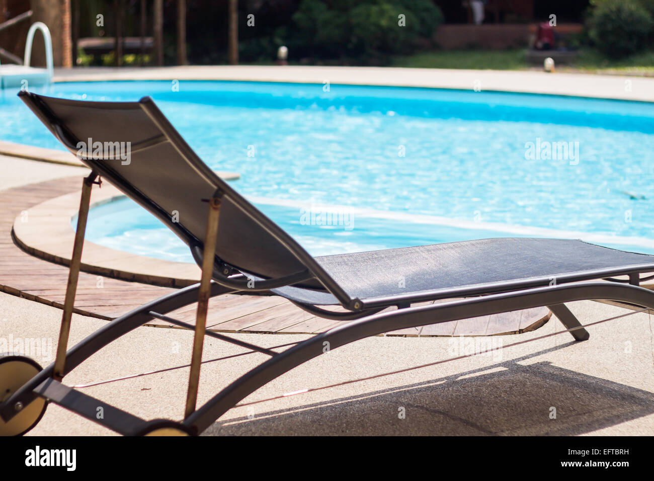 Swimming pool with beach chairs, stock photo Stock Photo - Alamy