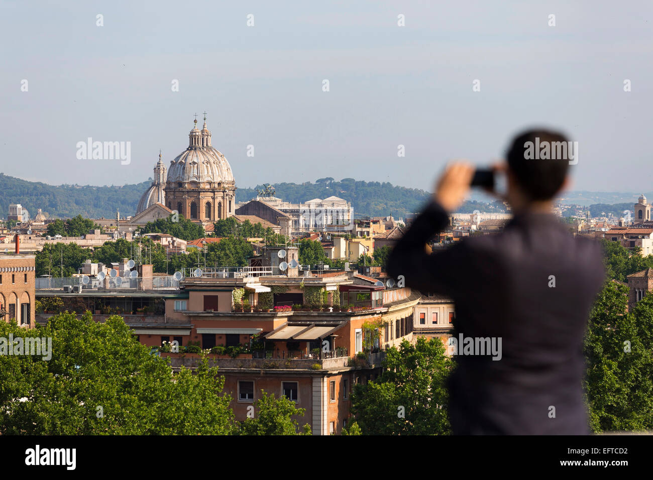 Man taking picture of the roman rooftops. Rome, Italy Stock Photo - Alamy