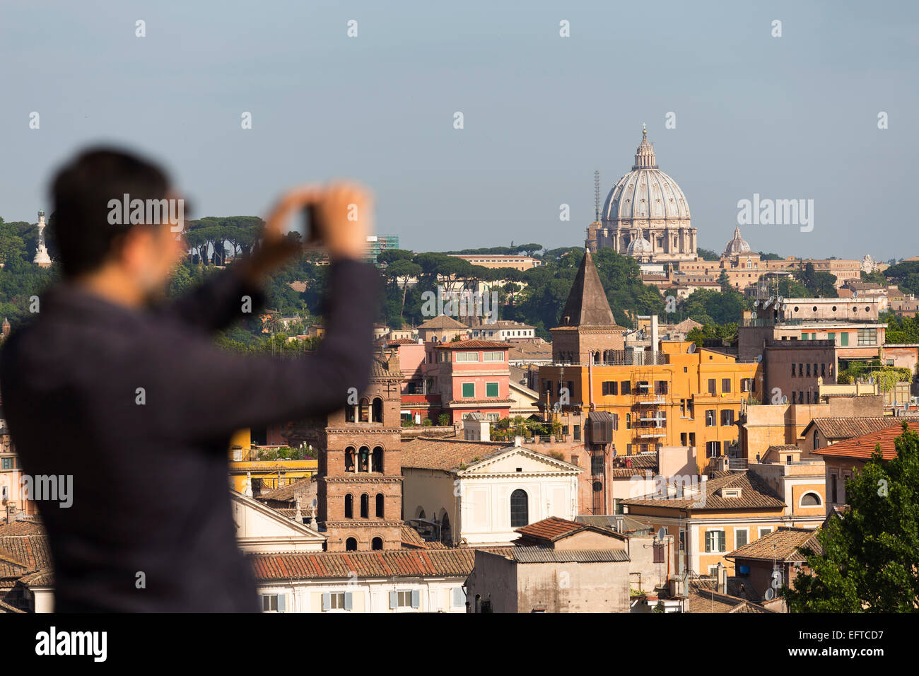 Man taking picture of the roman rooftops. Rome, Italy Stock Photo - Alamy