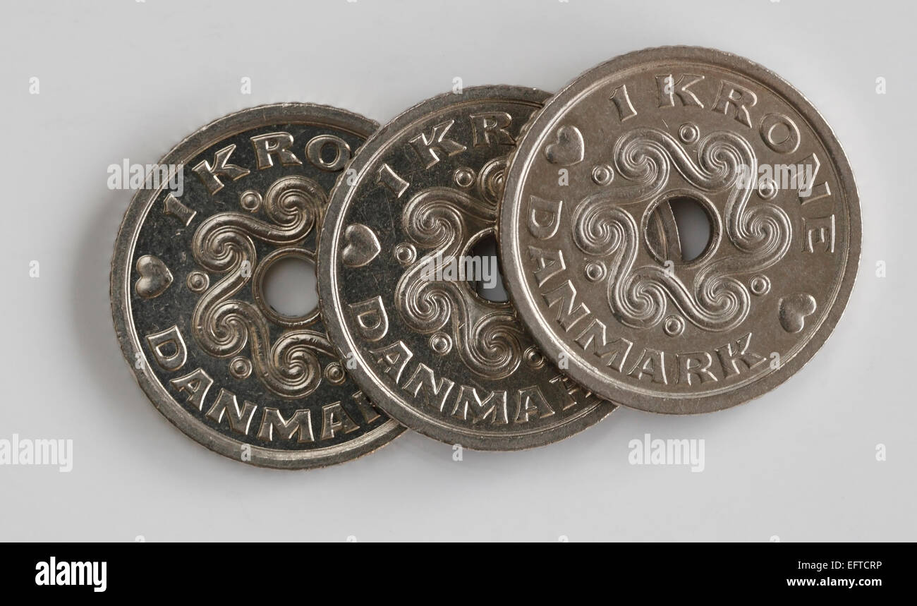 Three Danish one Kroner pieces on a white background Stock Photo - Alamy