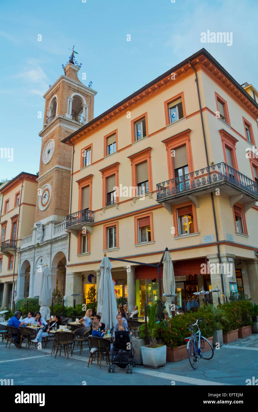 Cafe terrace and clock tower, Piazza Tre Martiri square, centro storico ...