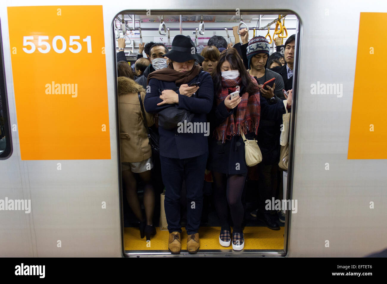Commuters crowded onto the Tokyo subway. The combined subway network of ...
