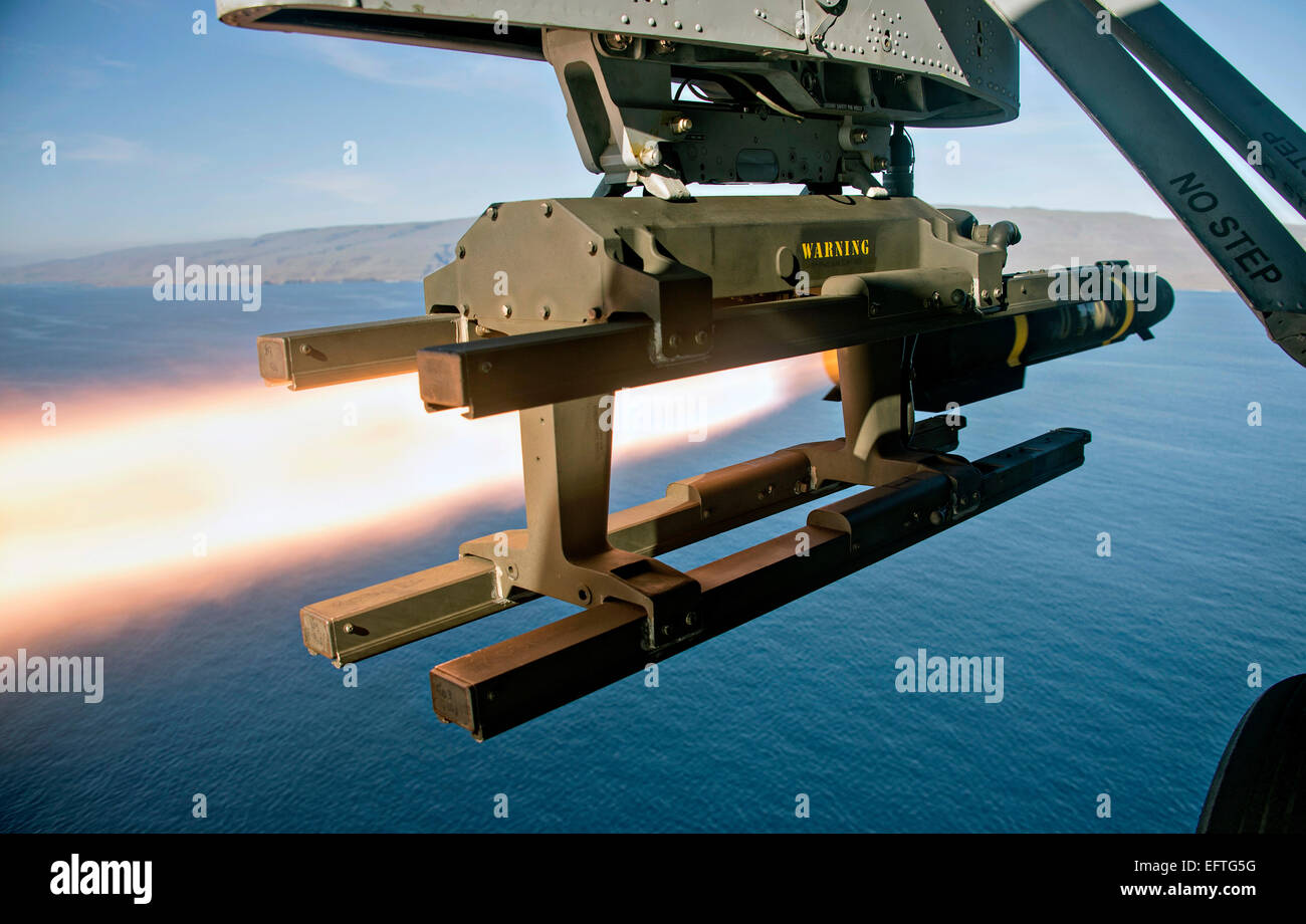 Close up of a US Navy MH-60S Sea Hawk helicopter firing a AGM-114B ...