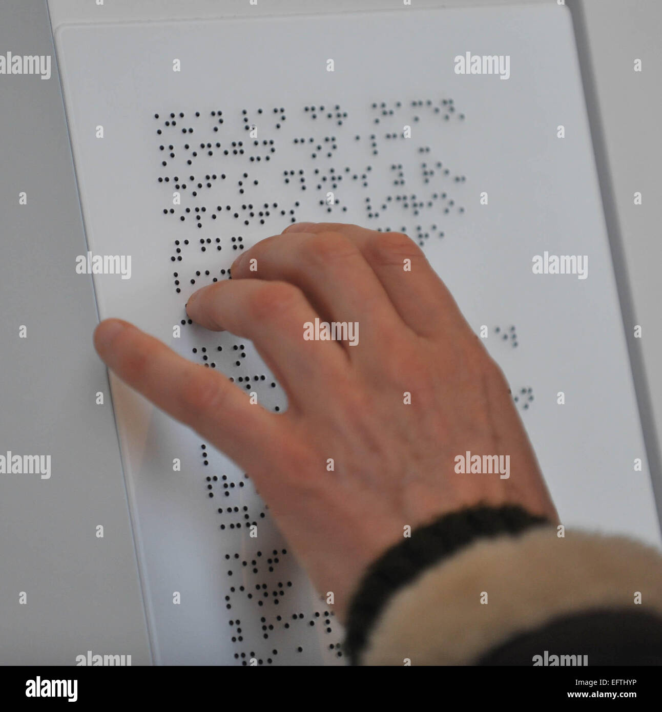Madrid, Spain. 10th Feb, 2015. A blind visitor reads Braille ...
