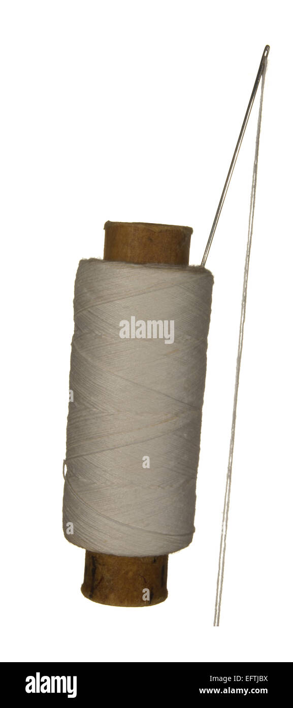 Spool of white thread and needle isolated on white background Stock ...
