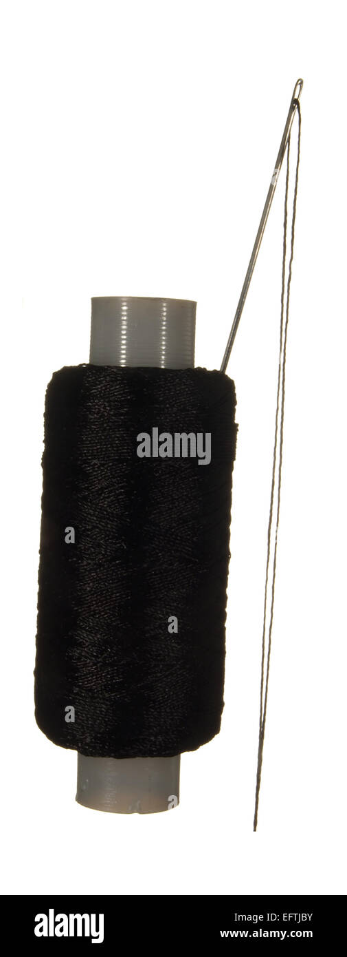 Spool of black thread and needle isolated on white background Stock ...