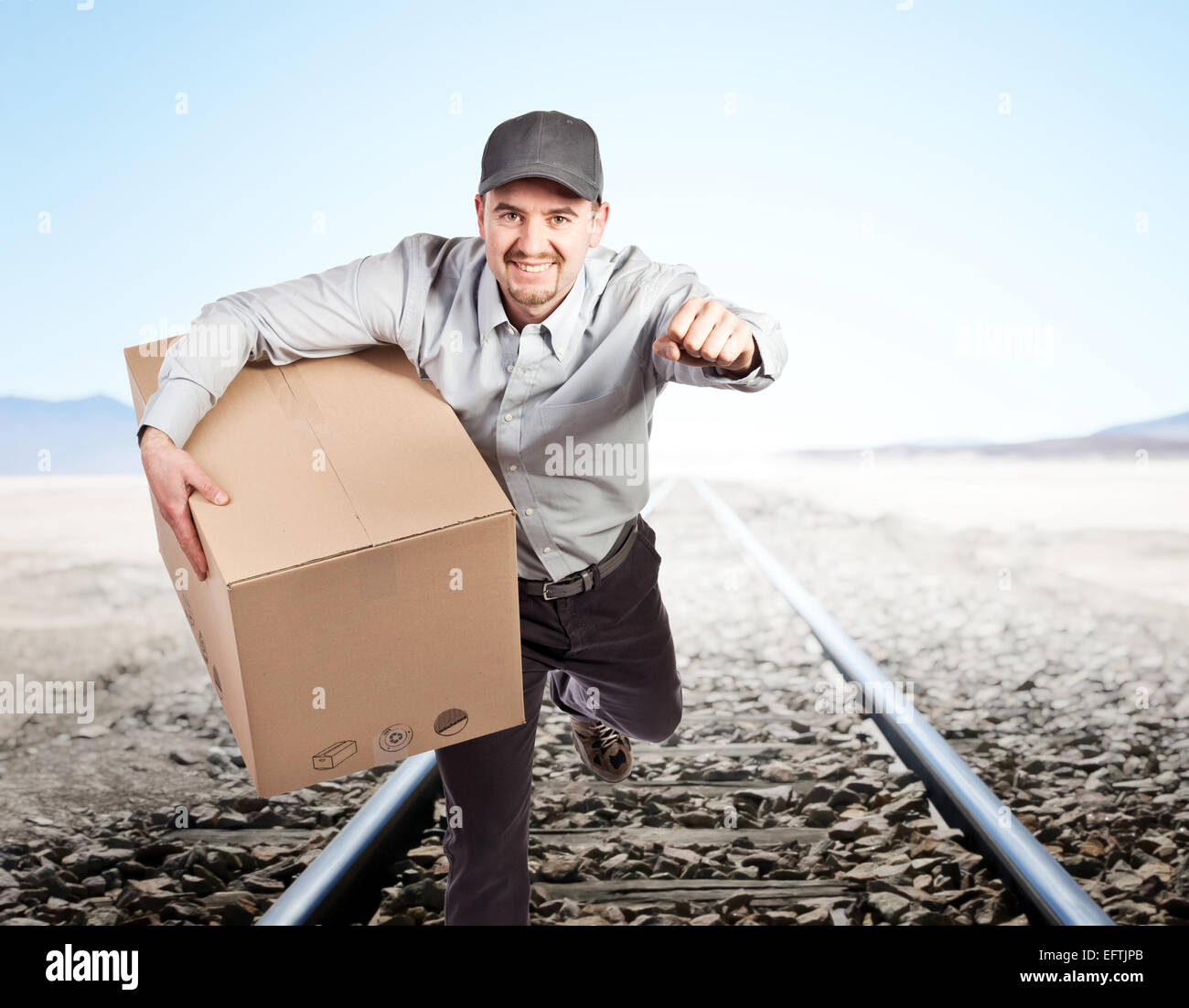 smiling delivery man and desert background Stock Photo - Alamy
