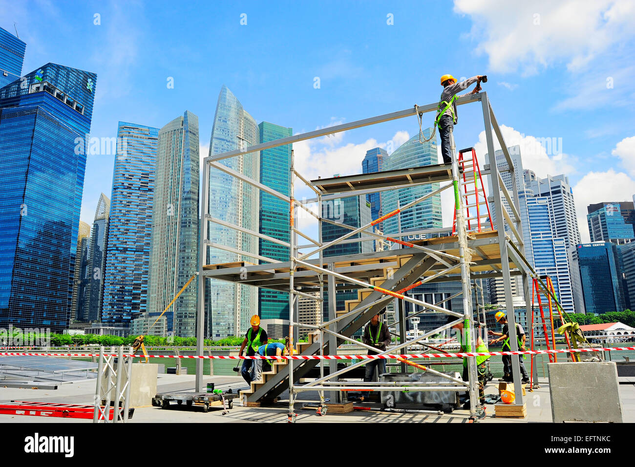 Workers at construction site in front of Singapore downtown in ...