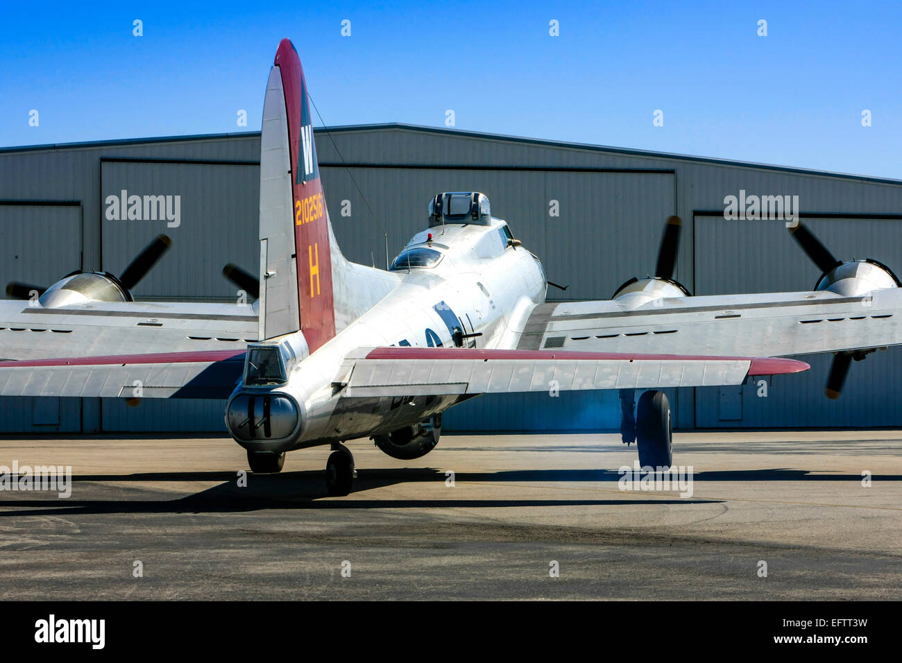 Taxiing out to the runway, the B17G Flying Fortress, "Aluminum Overcast" WW2 bomber plane seen ...