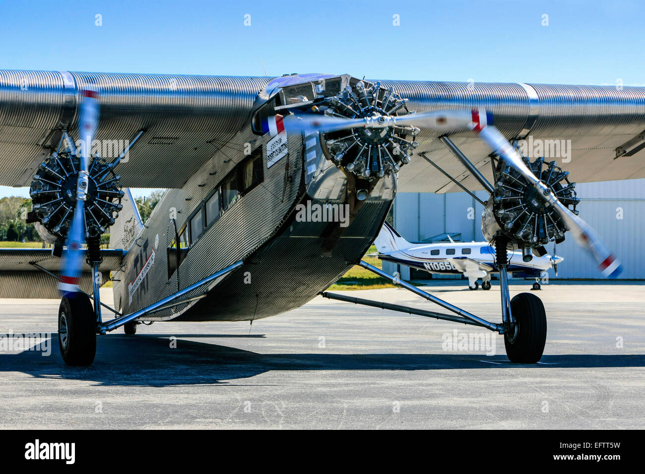 Passengers on board start the three Wright J-6-9 Whirlwind nine ...