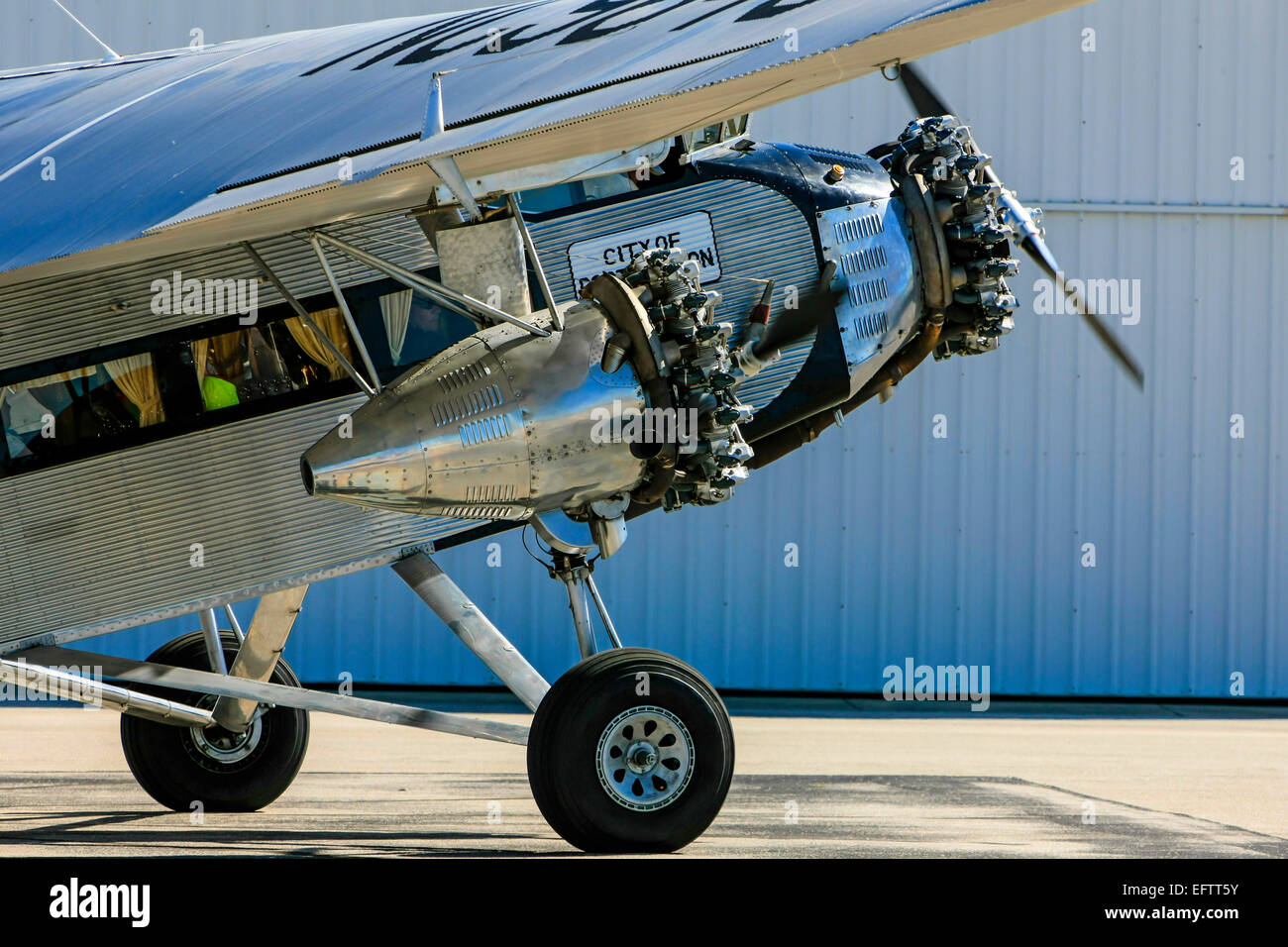 Passengers on board start the three Wright J-6-9 Whirlwind nine ...
