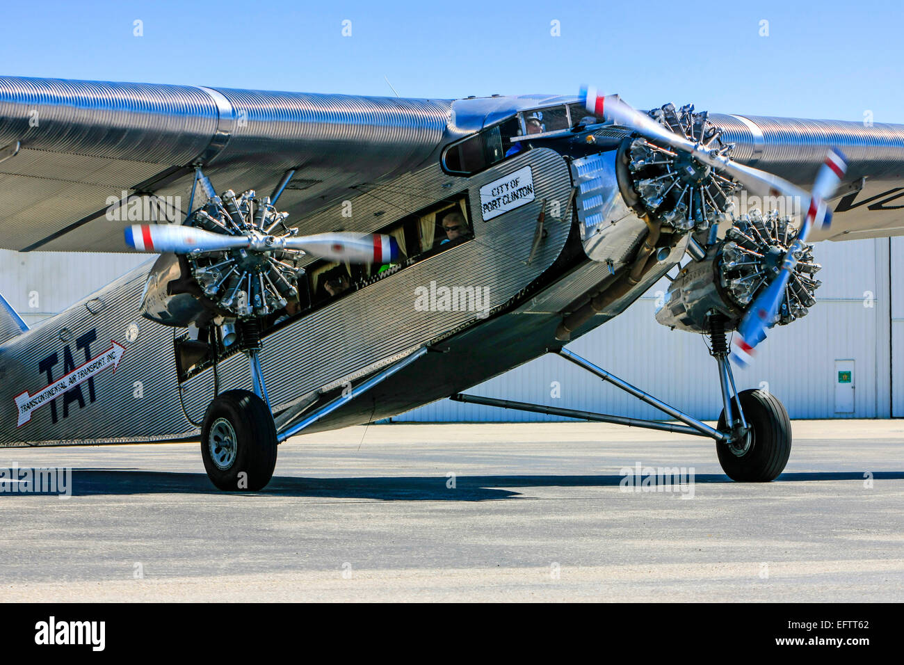 Passengers on board start the three Wright J-6-9 Whirlwind nine ...