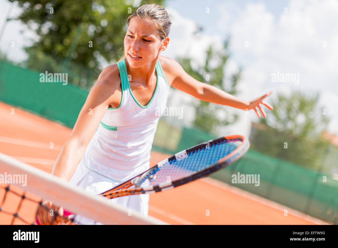 Young woman playing tennis Stock Photo - Alamy