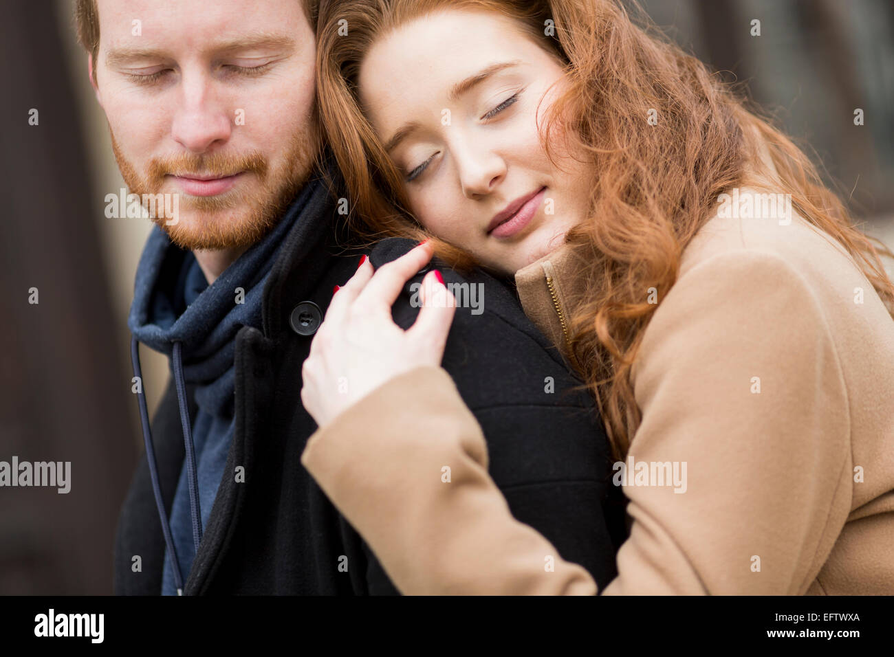 Young red hair couple at autumn park Stock Photo - Alamy