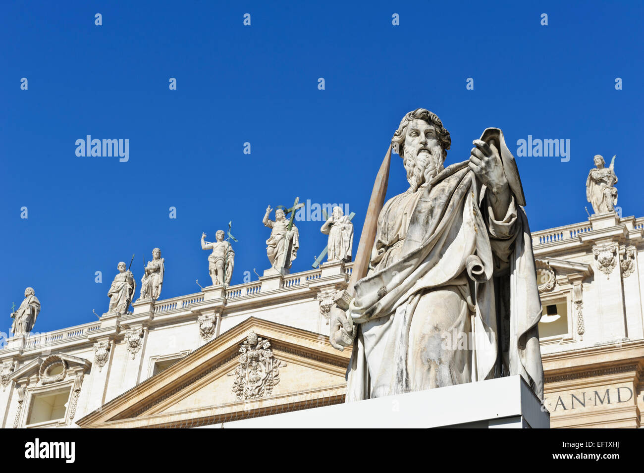 Statue of St. Paul holding a sword outside St Peter's basilica at the ...