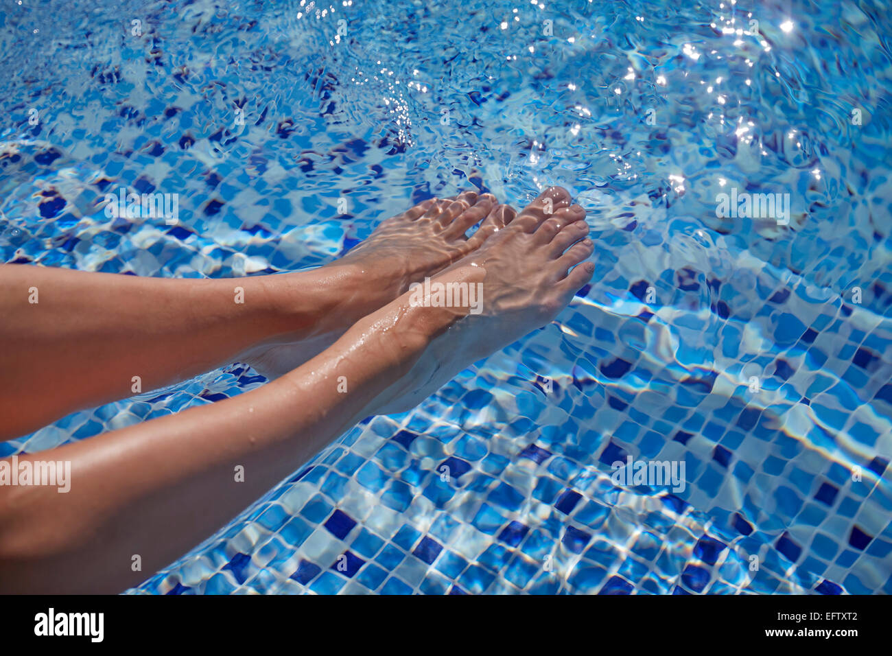 Feet pool splash hi-res stock photography and images - Alamy