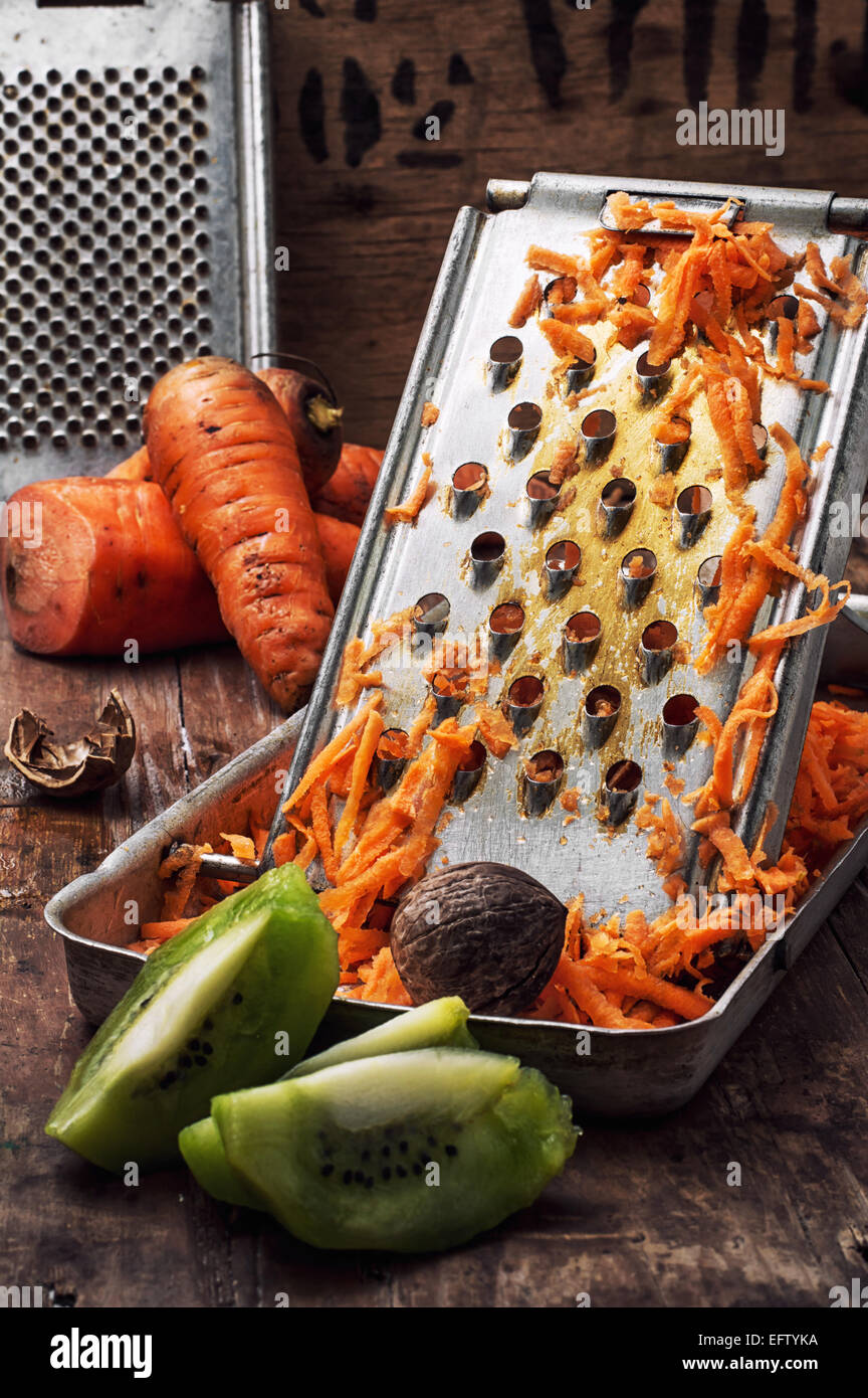 process of rubbing fragrant ripe fruit and carrots fruit salad Stock ...