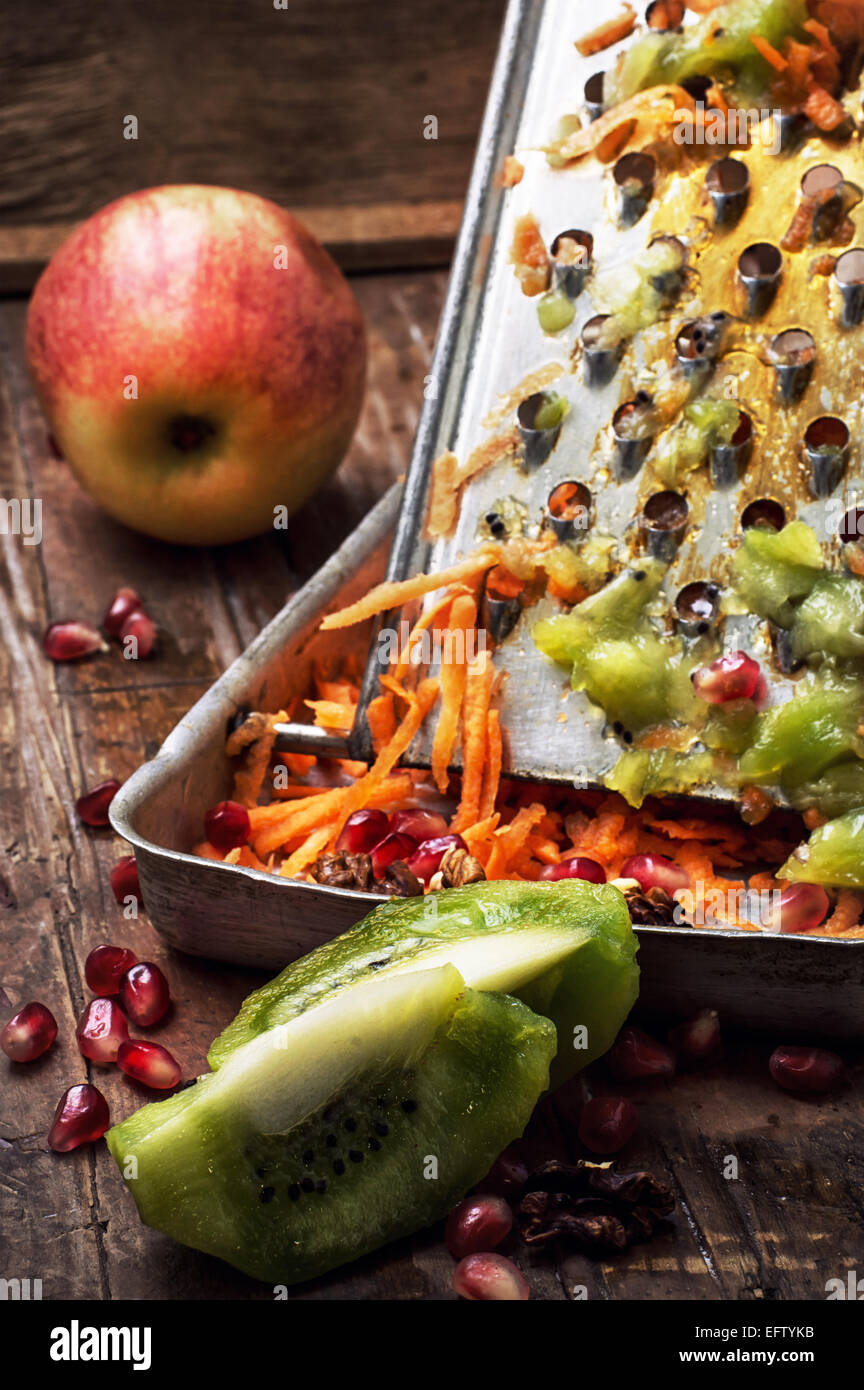 process of rubbing fragrant ripe fruit and carrots fruit salad Stock ...