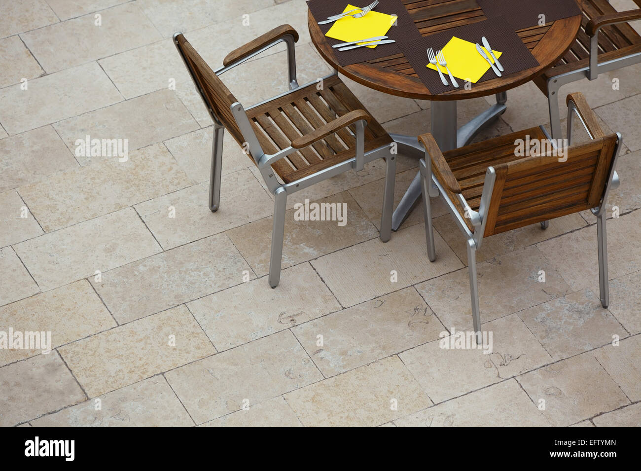 Outdoor summer cafe tables with chairs. View from above. Copy space ...