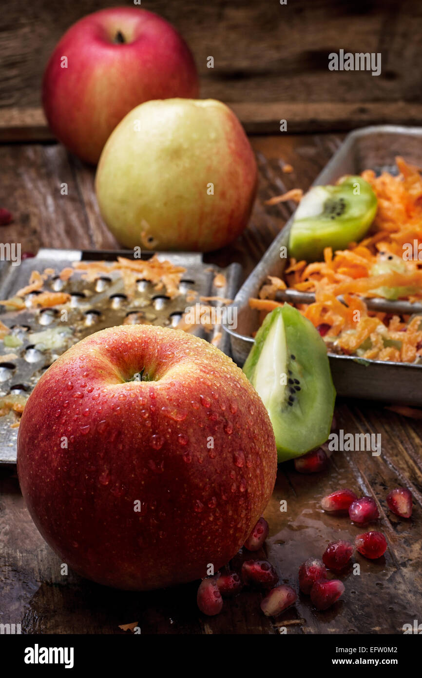 process of rubbing fragrant ripe fruit and carrots fruit salad Stock ...