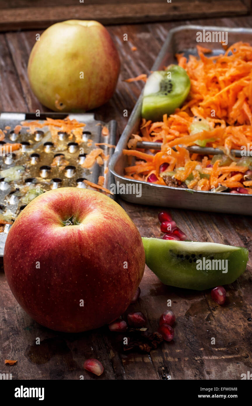 process of rubbing fragrant ripe fruit and carrots fruit salad Stock ...
