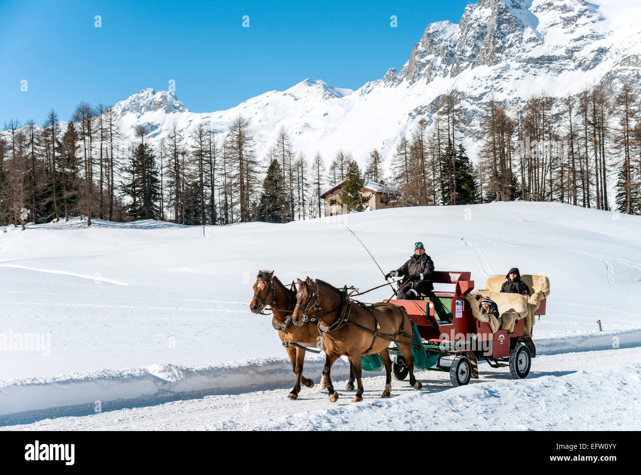 Switzerland, Sils Maria, Sleigh at Val Fex against a panorama of the ...