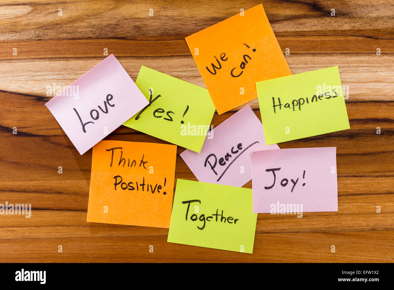 office desk with multiple sick notes with positive messages on them ...