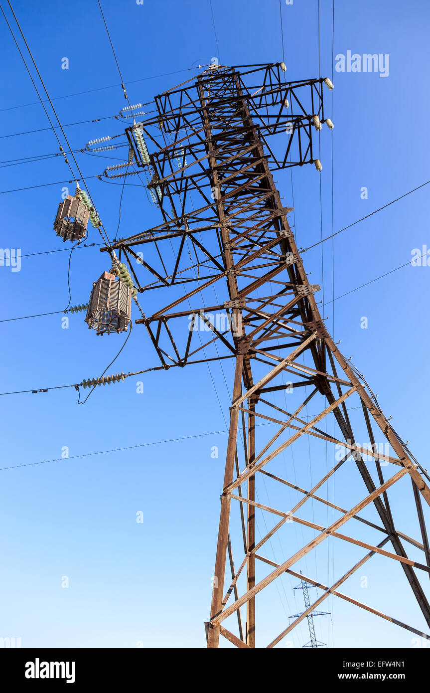 Power line wiring and insulators system over blue sky Stock Photo - Alamy