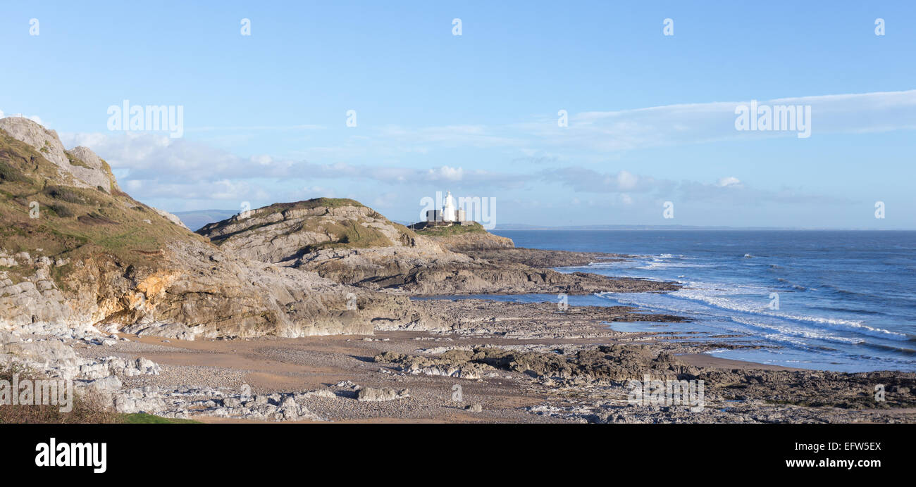 Mumbles Lighthouse seen across Bracelet Bay on The South Wales Coast ...