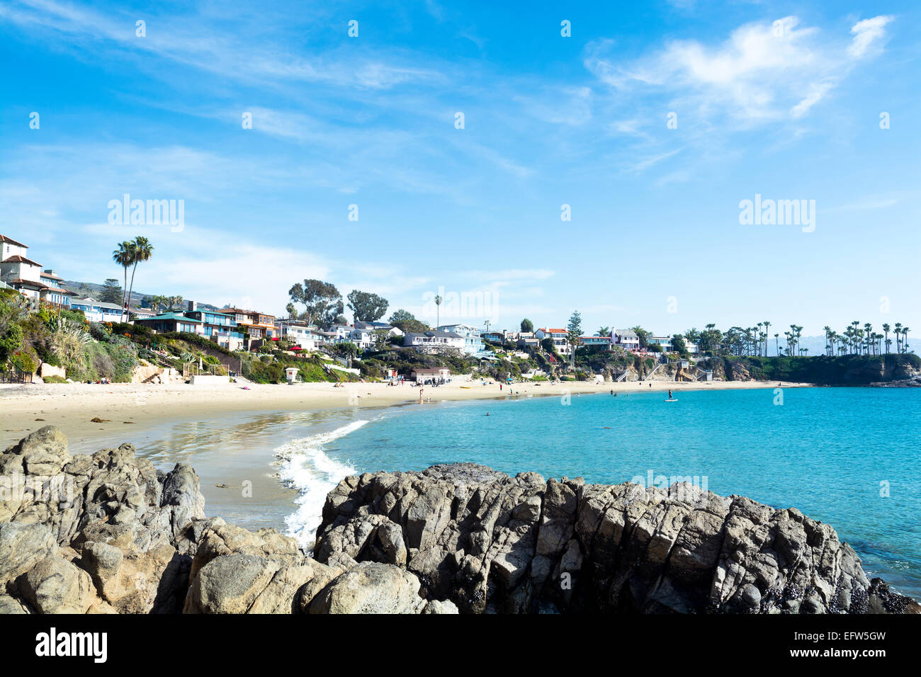 A view of a secluded beach front cove shows beautiful turquoise water ...