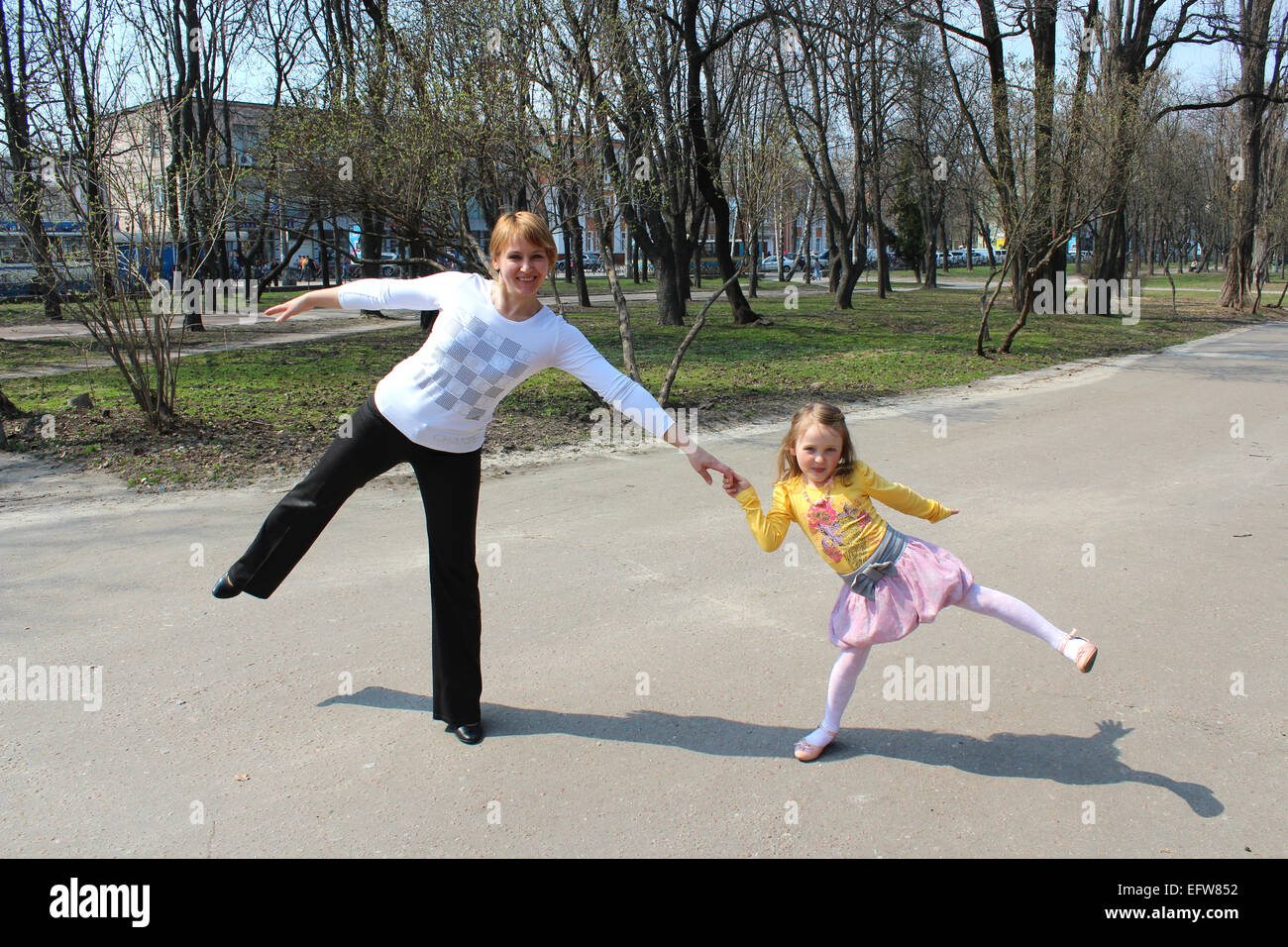 image of mother and the daughter dancing in the city Stock Photo - Alamy