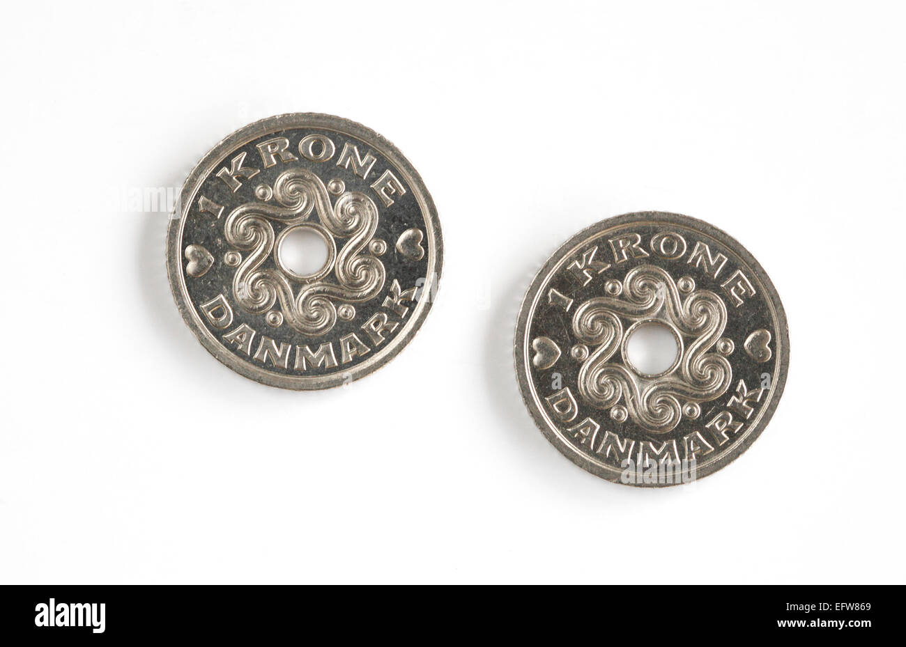 Two Danish one Kroner pieces on a white background Stock Photo - Alamy