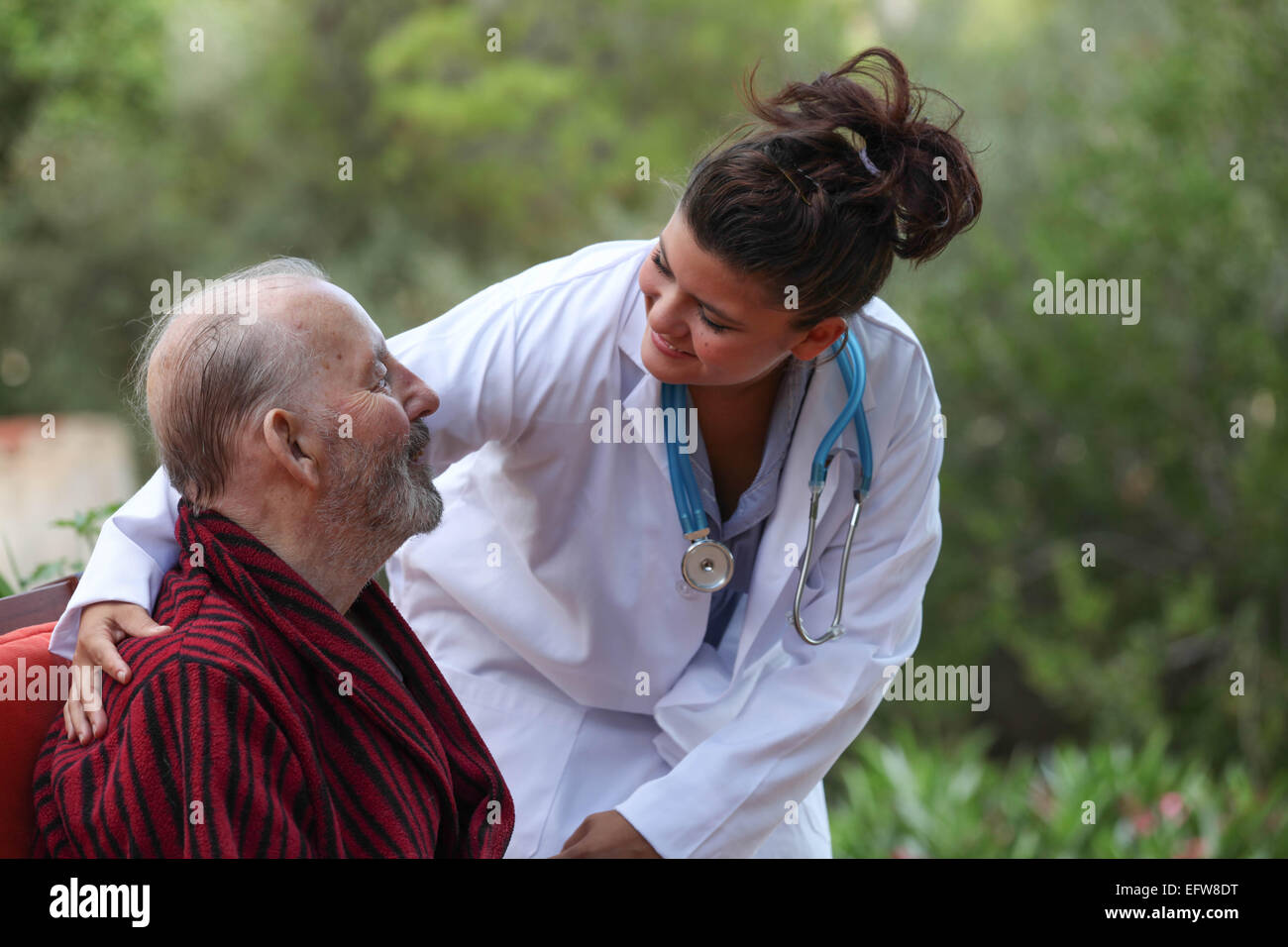 smiling Doctor caring for patient Stock Photo - Alamy