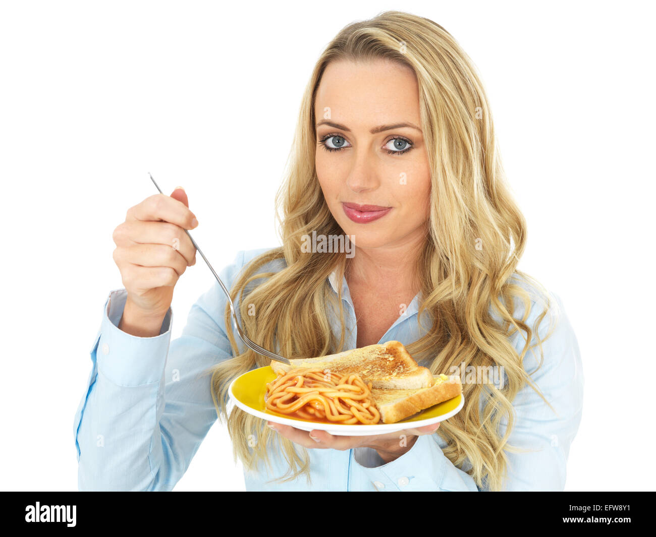 Attractive Young Woman Eating Spaghetti on Toast Stock Photo - Alamy