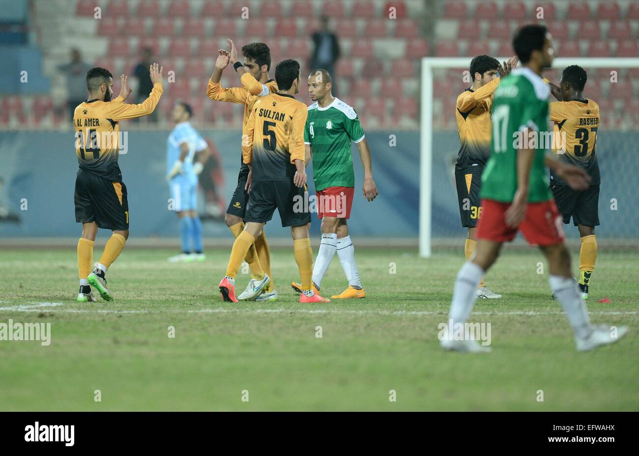 Kuwait City, Kuwait. 10th Feb, 2015. Players (in yellow and black ...