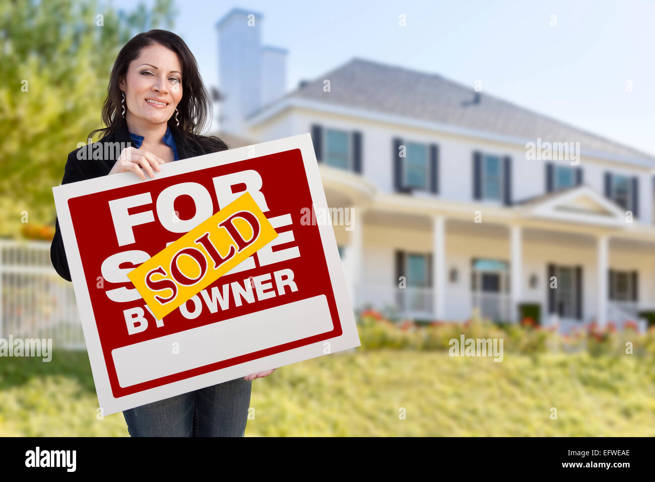 Realtor showing sold sign happy and excited. Smiling joyful Asian ...