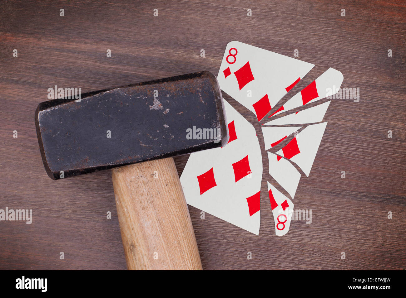 Hammer with a broken card, vintage look, eight of diamonds Stock Photo ...