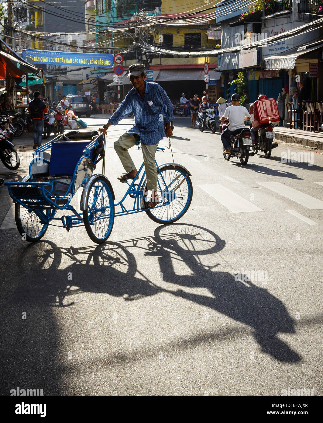 Cyclo driver at Bui Vien Street in Pham Ngu Lao District, Ho Chi Minh ...