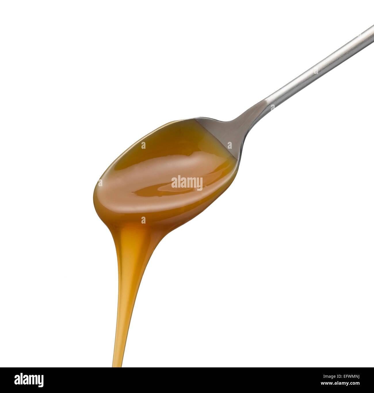 Caramel dripping off a silver spoon Stock Photo - Alamy